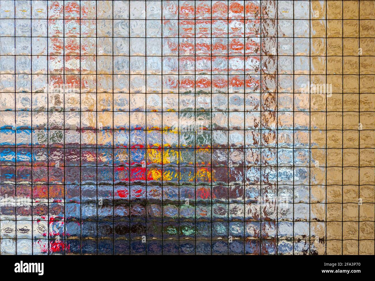 Close up a black grid metal fence of a glass window and blur outside ...