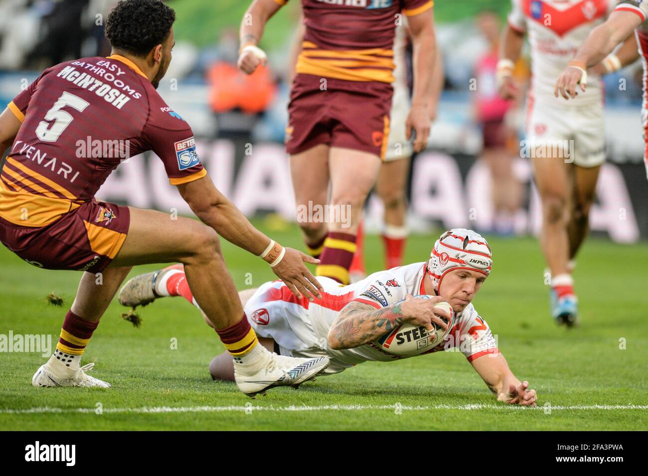 Huddersfield, UK. 22nd Apr, 2021. Theo Fages of St Helens scores a try ...