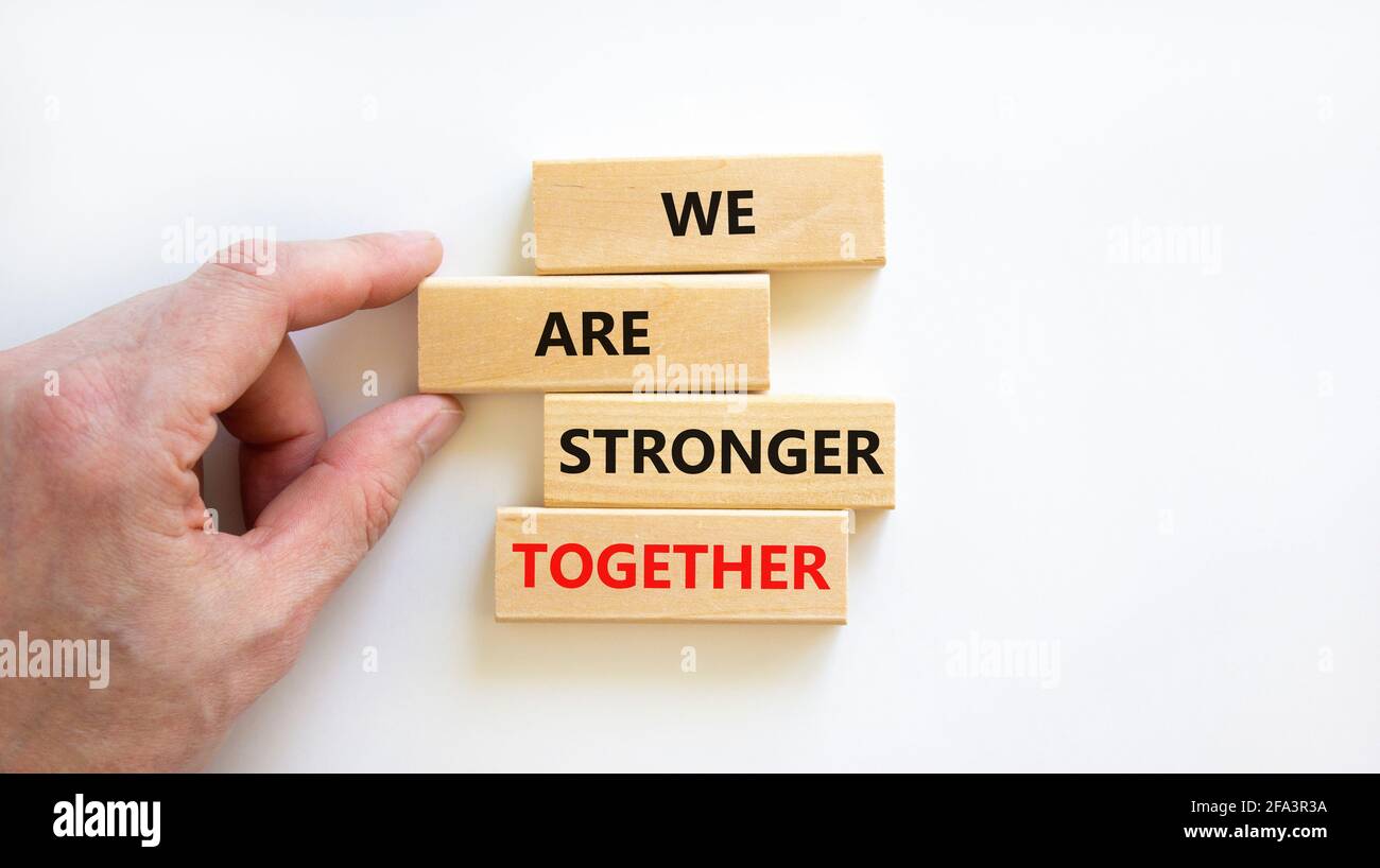 Stronger together symbol. Wooden block with words 'we are stronger ...