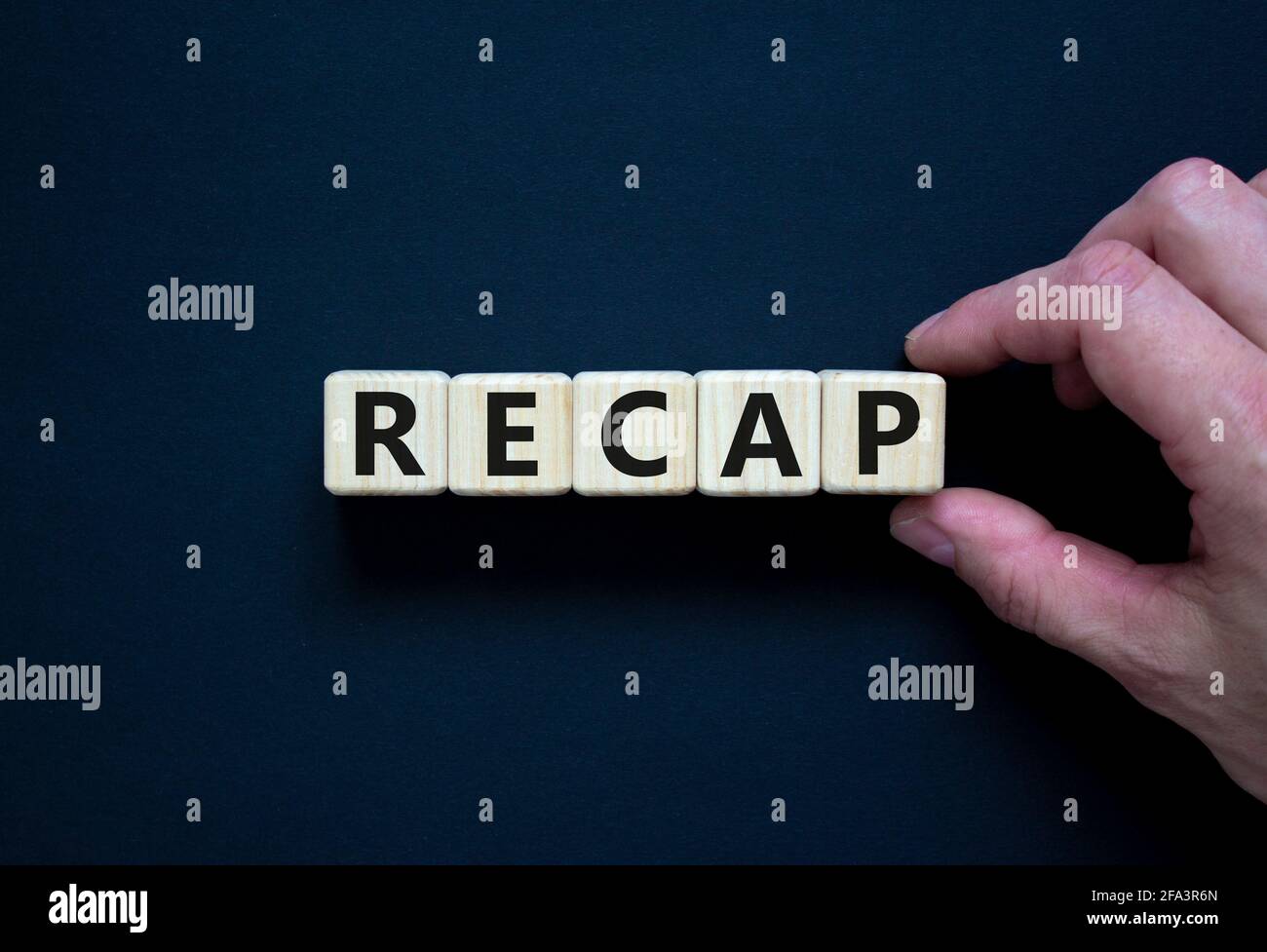 Recap symbol. Wooden cubes with word 'recap'. Businessman hand ...