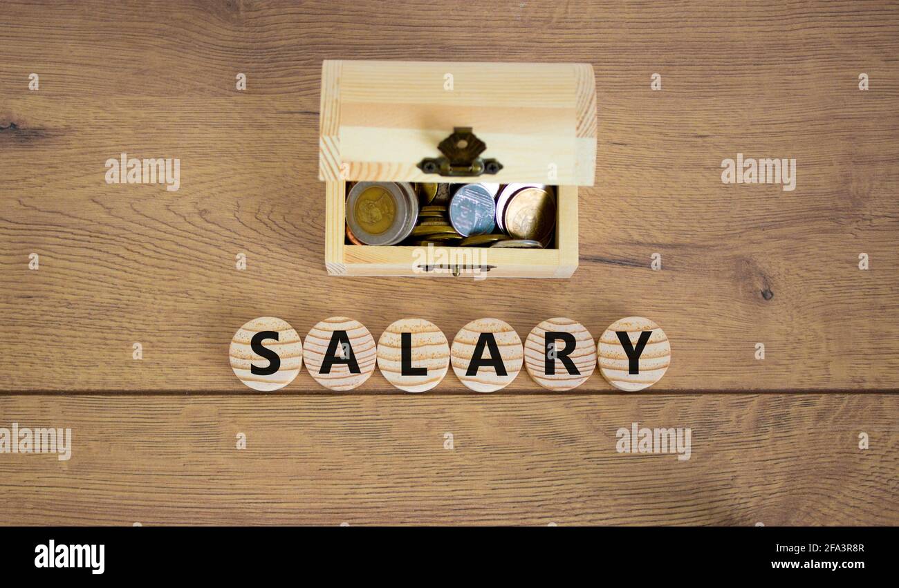 Salary symbol. Concept word salary on wooden cubes on a beautiful ...