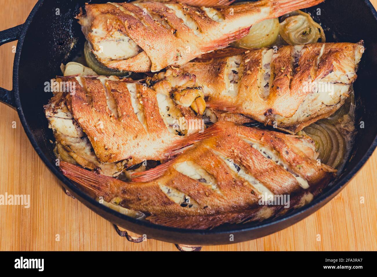 Fried sea bass fish. ish lunch meal cooking cuisine Stock Photo - Alamy