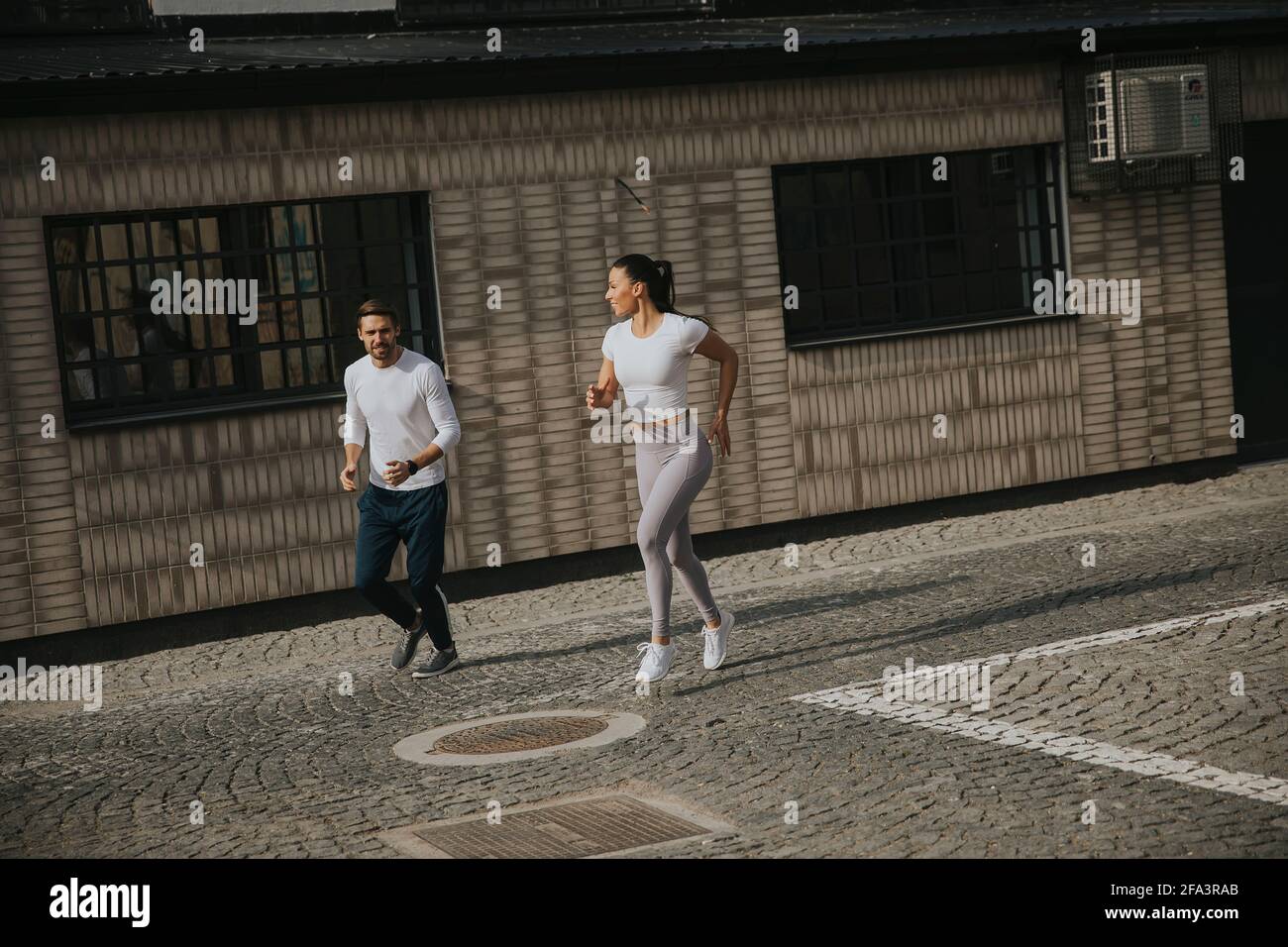 Adult adults man male woman female couple jogger runner runners hi-res ...