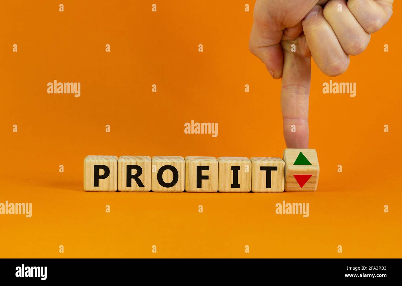 Profit level symbol. Businessman turns a cube and changes the ...