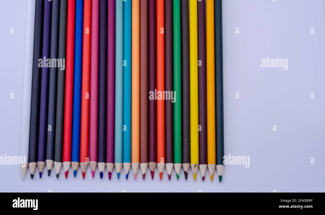 Colorful pencils on white background Stock Photo - Alamy