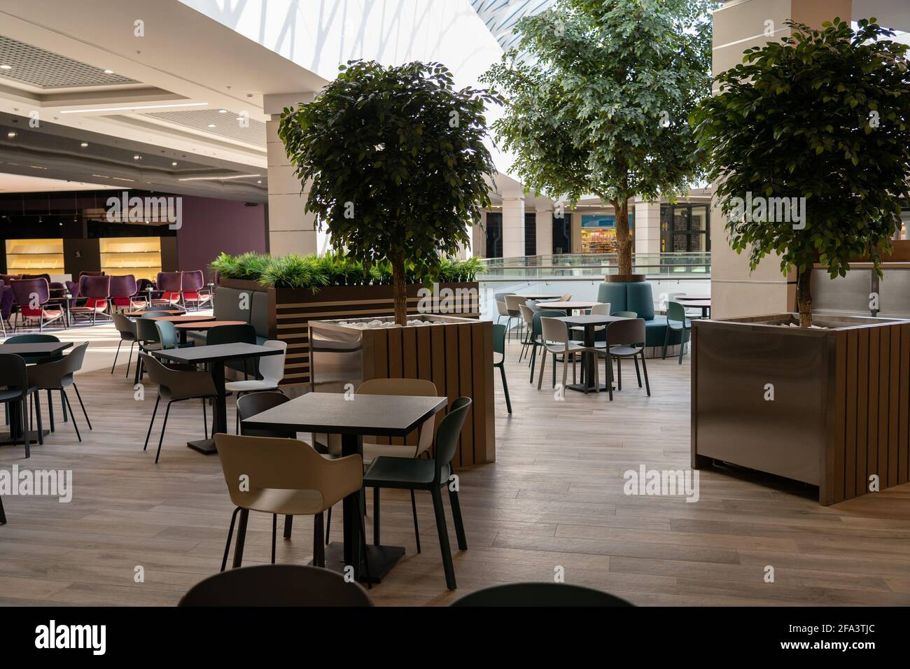 Interior of wooden table in food court shopping mall. Food center in ...