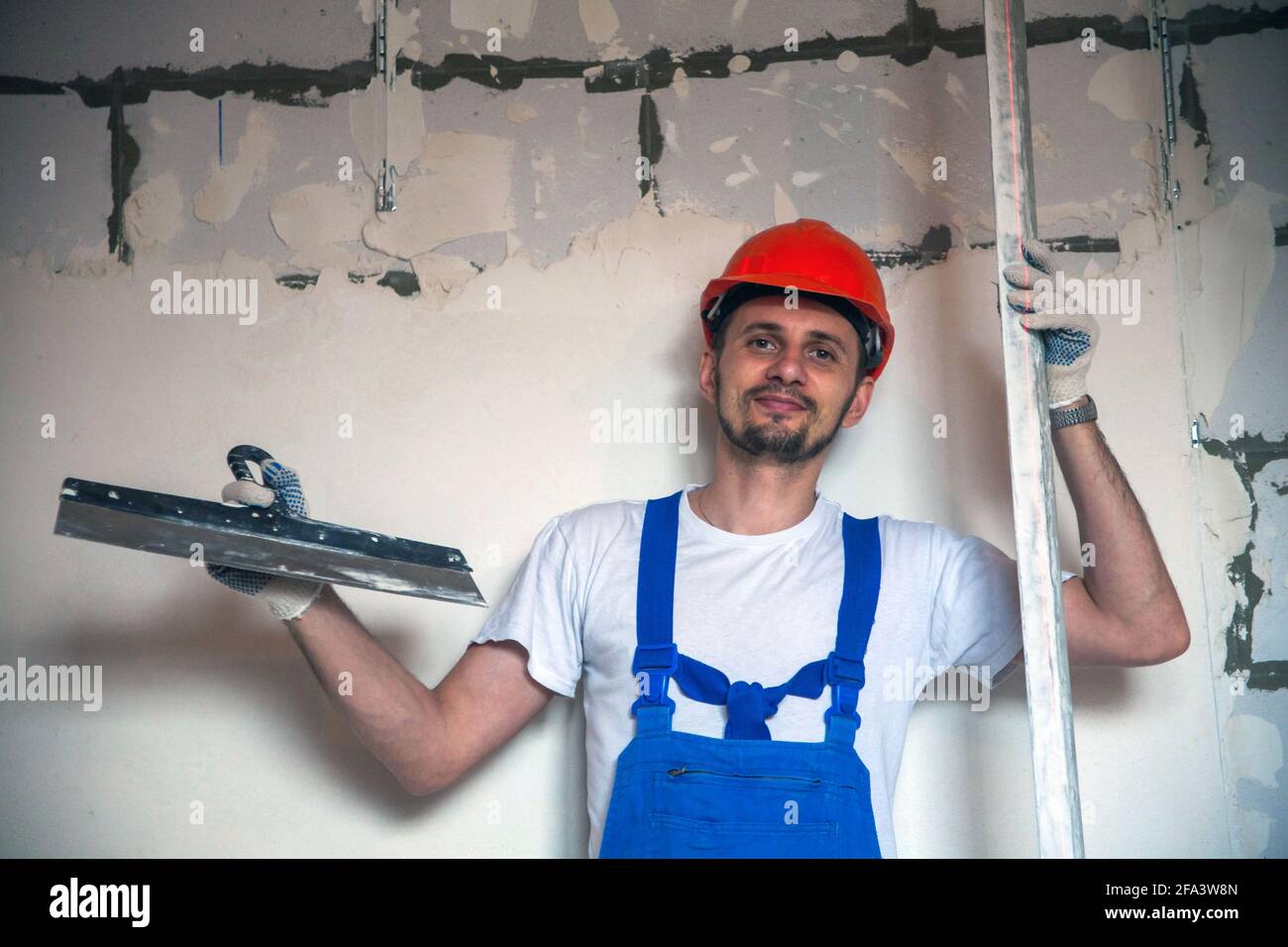 work on finishing the walls with mixtures of plaster and putty when ...