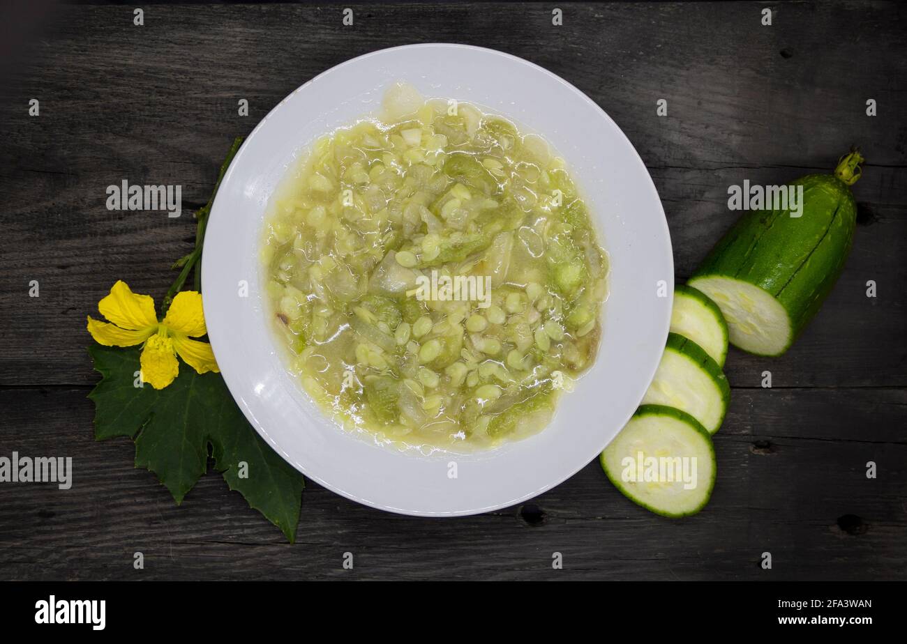Plate of fried luffa with onion and garlic. Asian kitchen Stock Photo ...