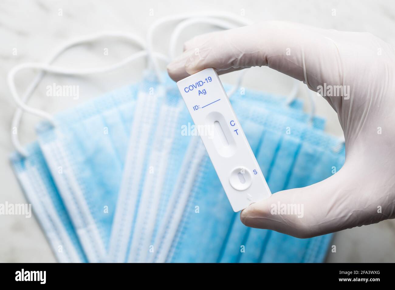 Covid-19 rapid antigen test. Rapid antibodies test kit in hand with ...