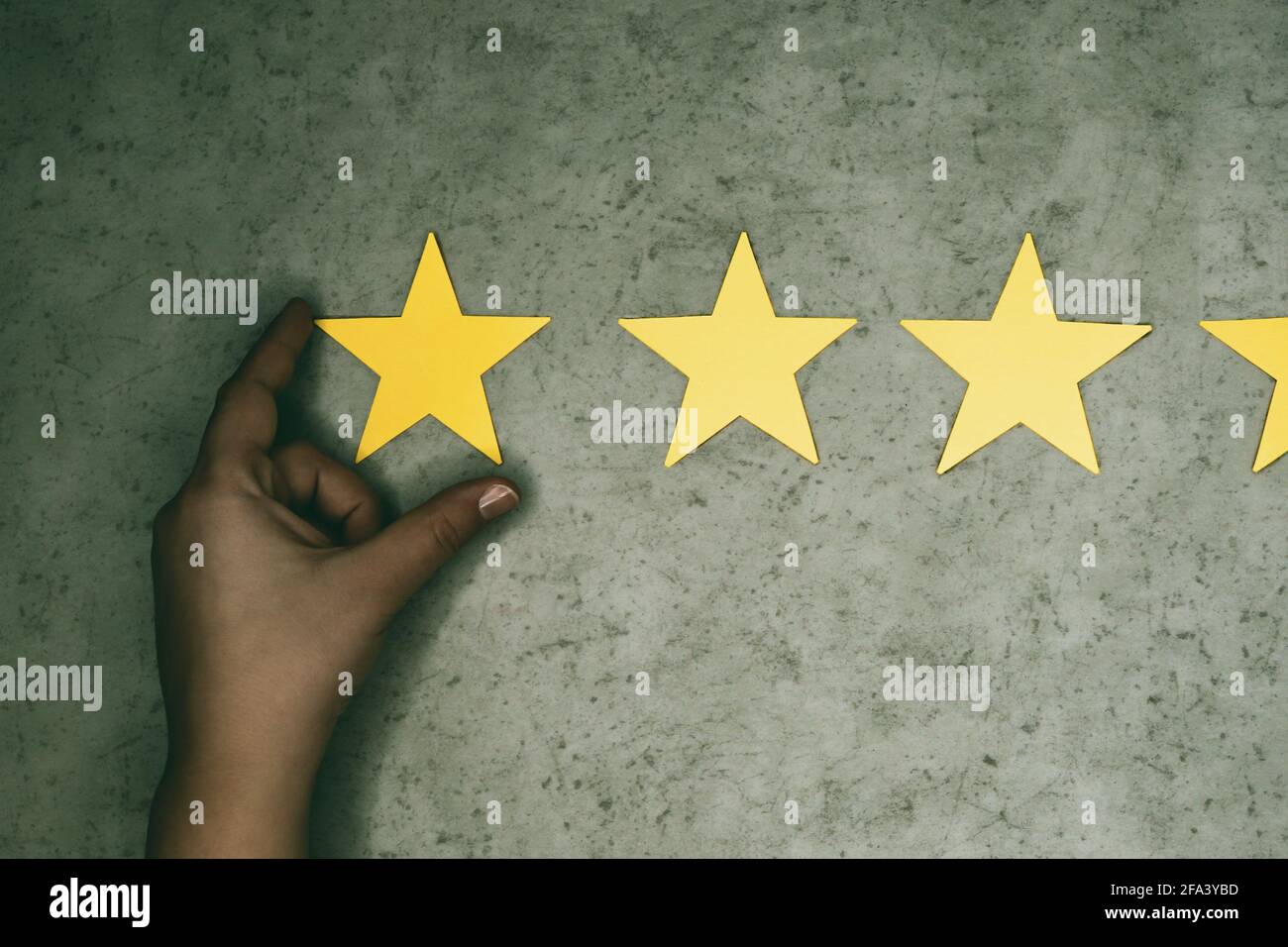 Customer Experience Concept. Three yellow stars on concrete background ...