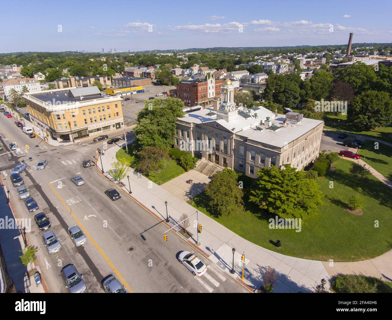 Waltham City Hall and downtown with Boston skyline at the background ...