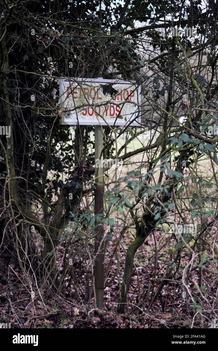 old petrol station sign hidden by overgrown bushes broome norfolk ...