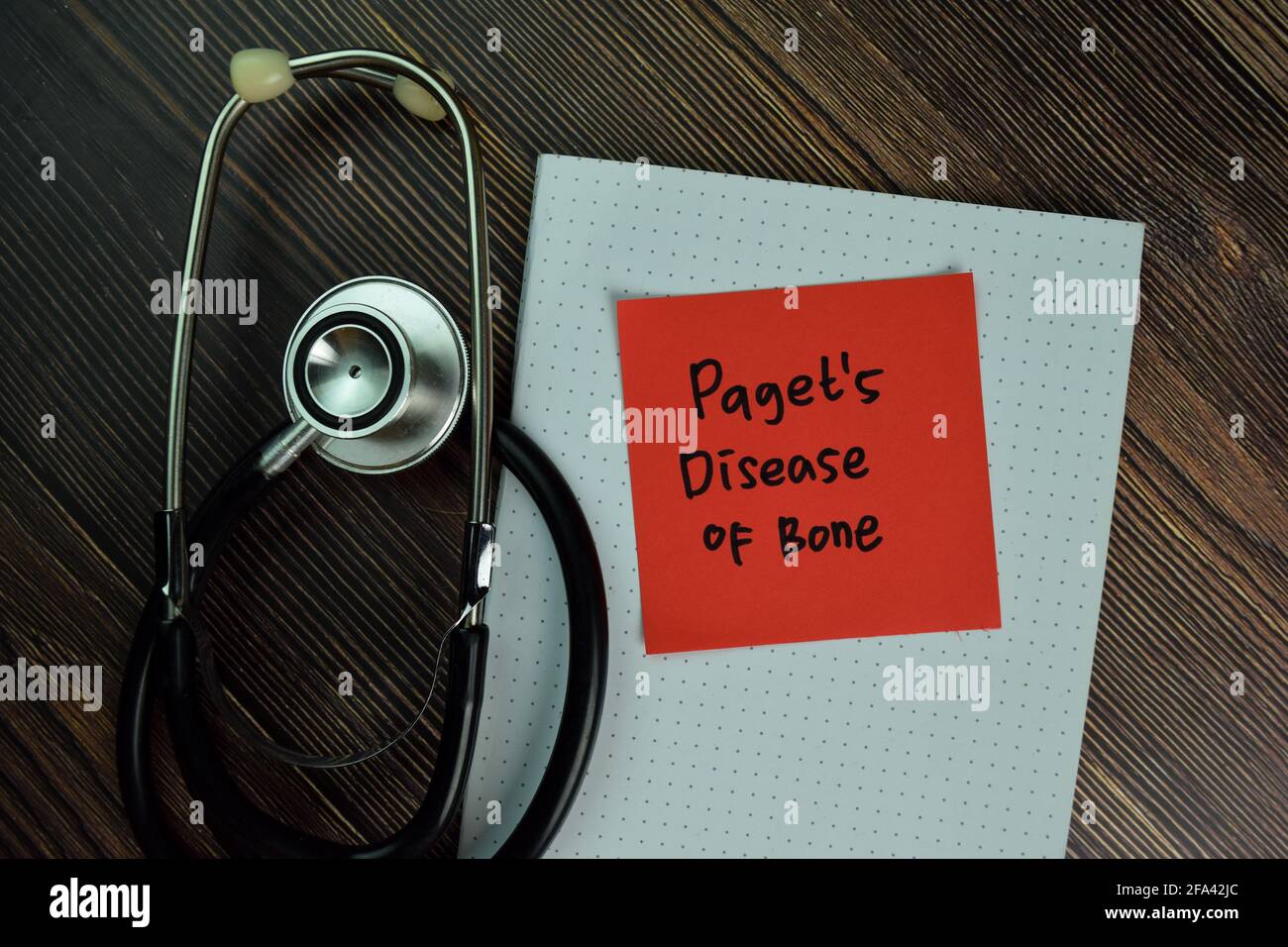 Paget's Disease of Bone write on sticky notes isolated on Wooden Table ...