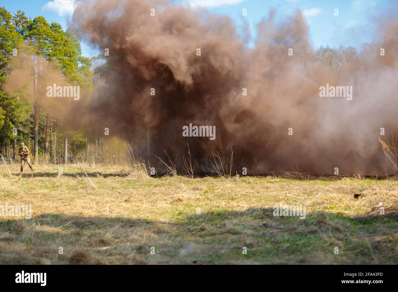 Reconstruction of the Second World War. A lot of smoke is emitted from ...