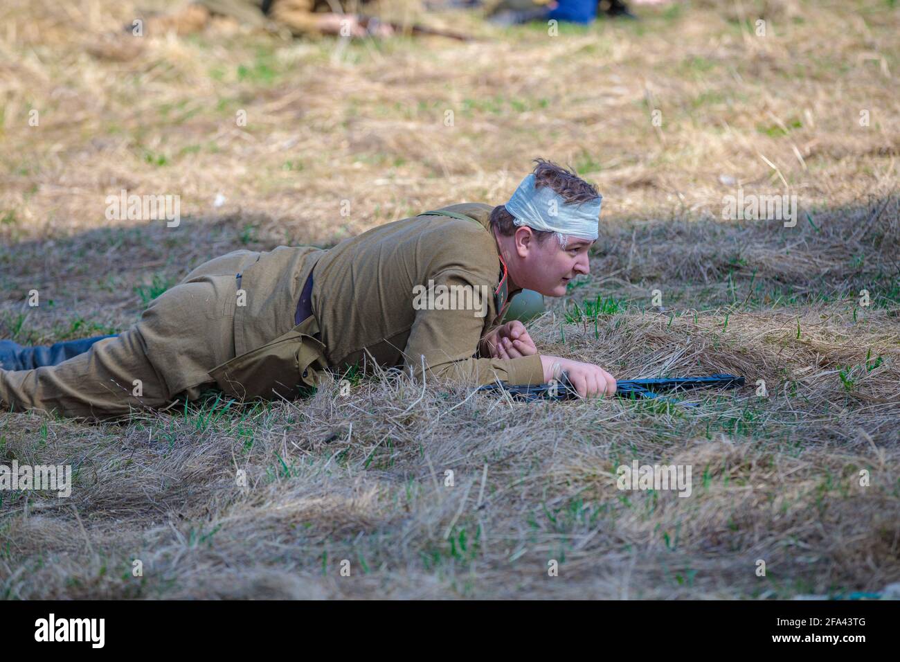 Reconstruction of the Second World War. Wounded soldiers lie on the ...