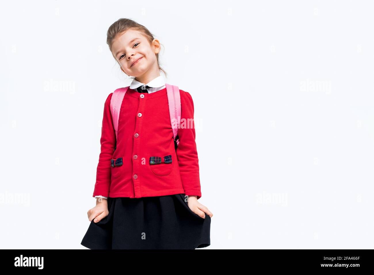 Adorable little girl in red school jacket, black dress, backpack Stock ...