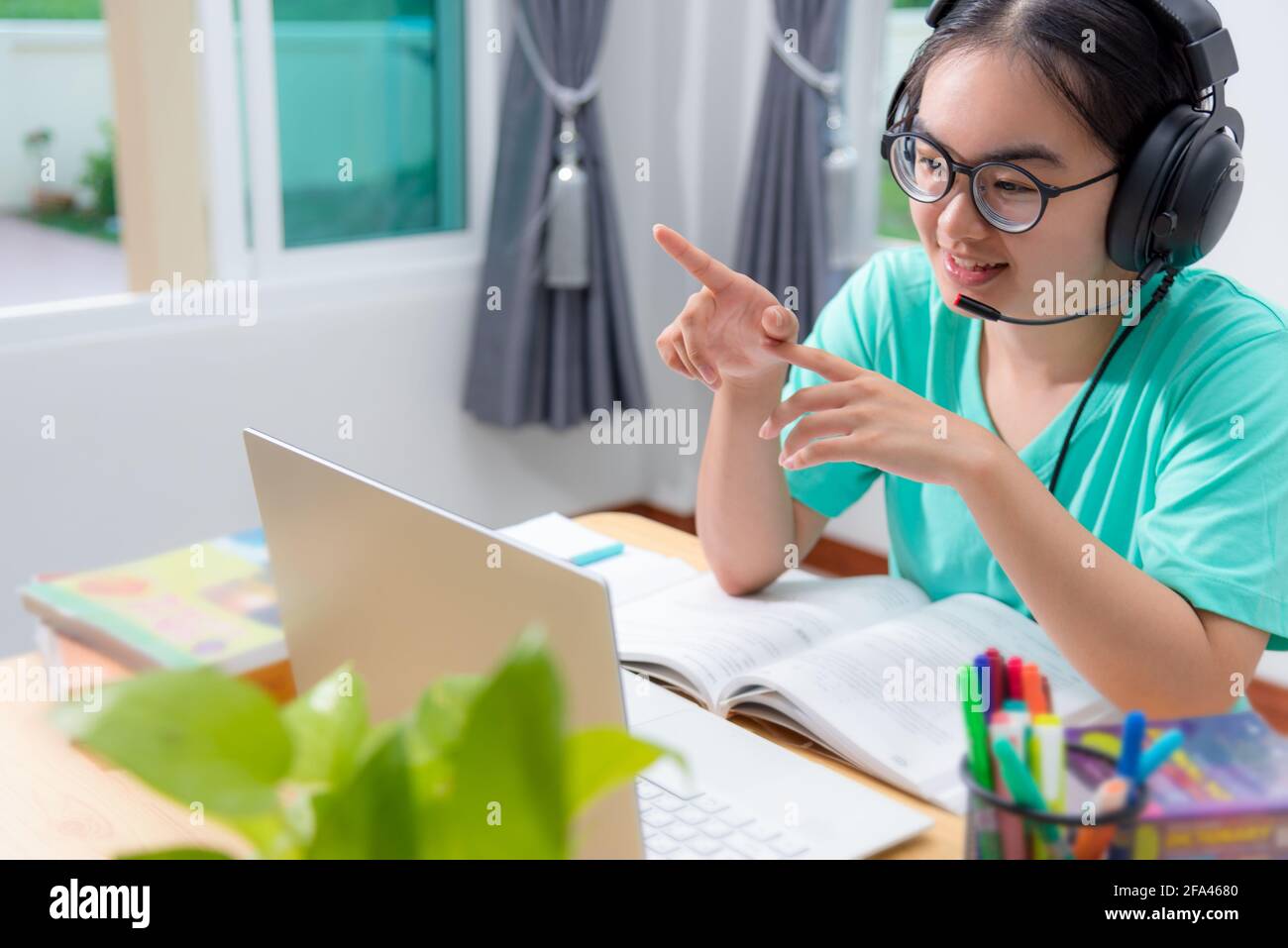 School students use laptop headset hi-res stock photography and images ...