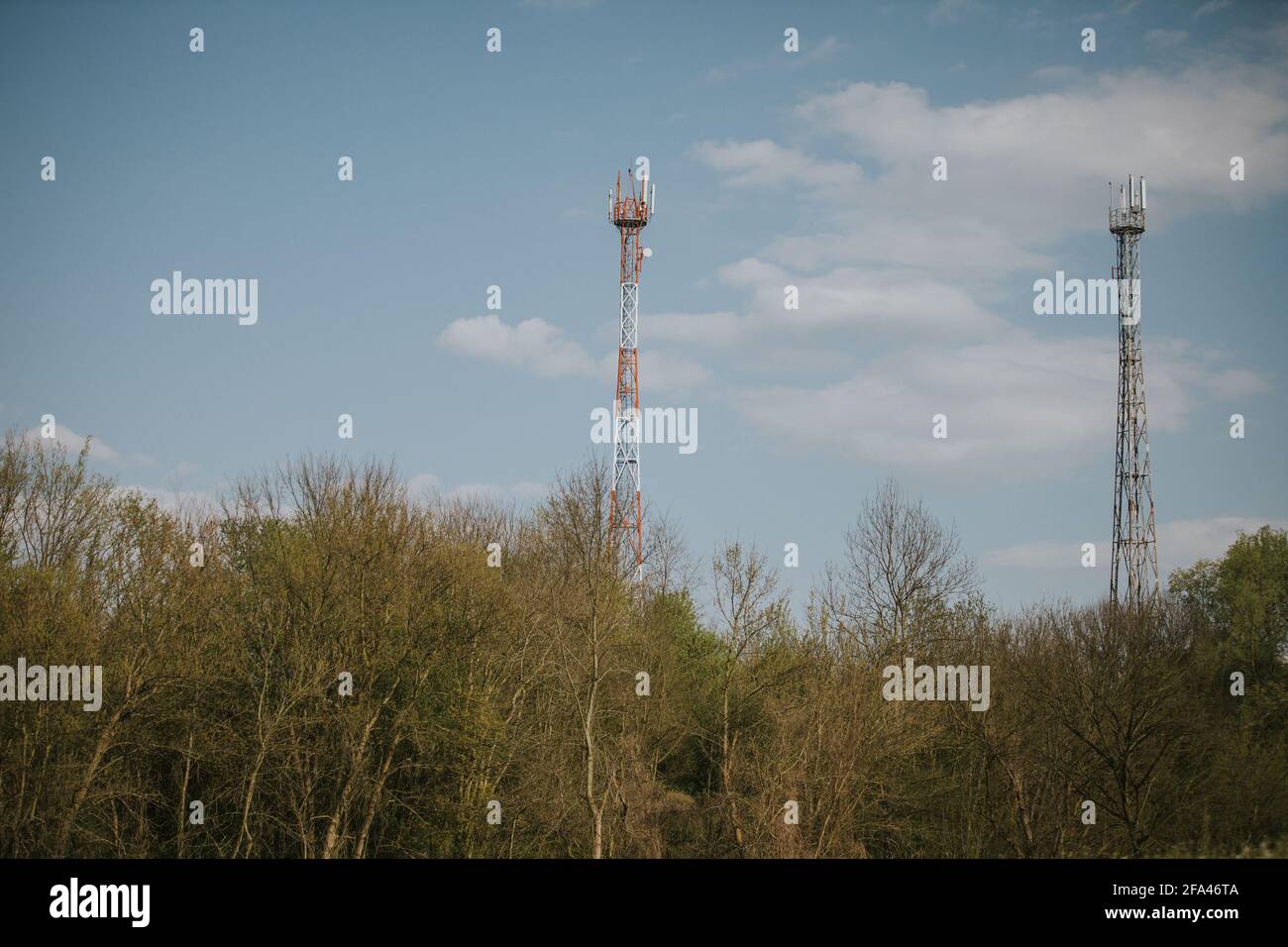 Television towers behind the trees Stock Photo - Alamy