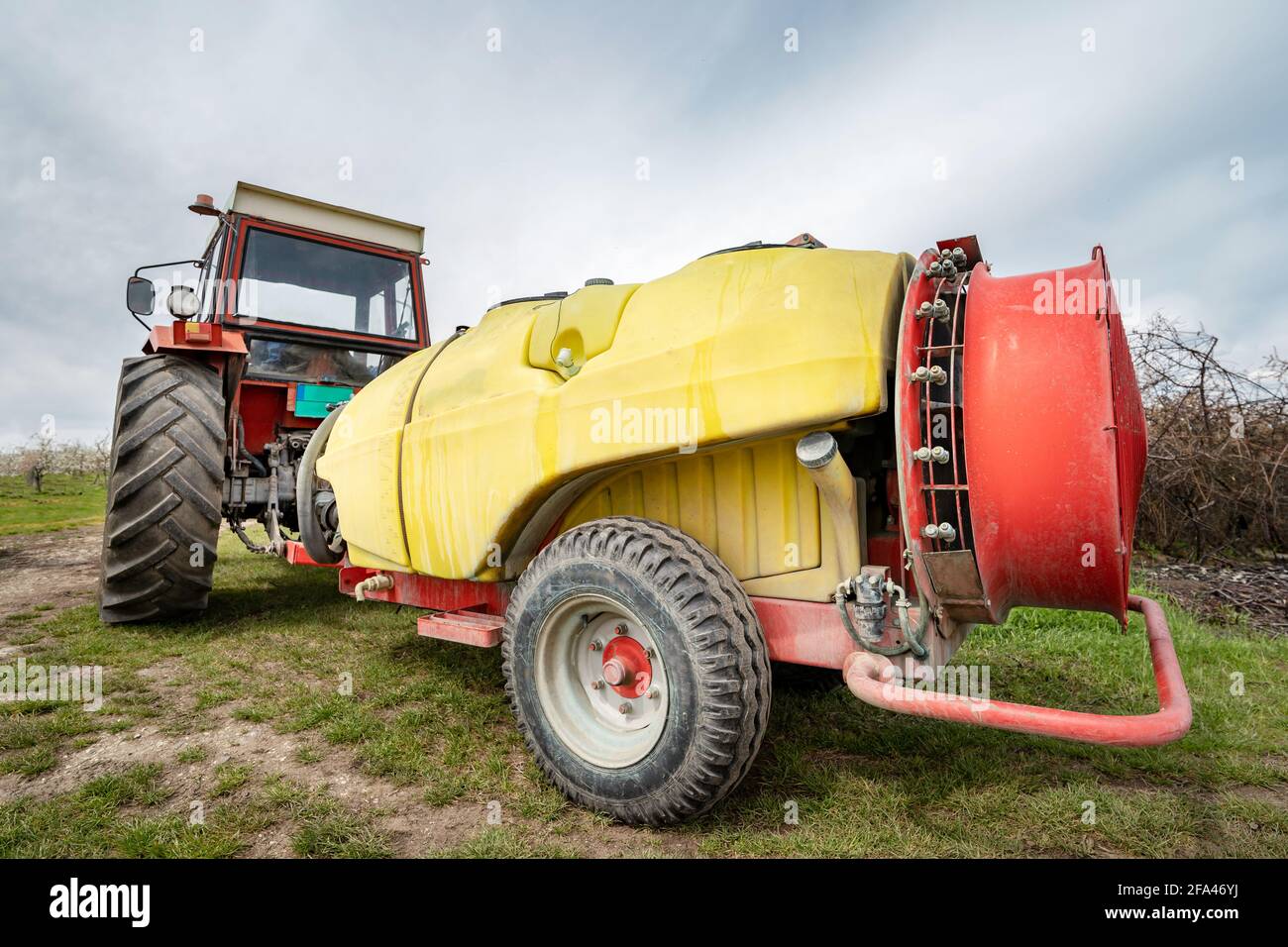 Tractor with agricultural sprayer machine with large fan ready to spray ...