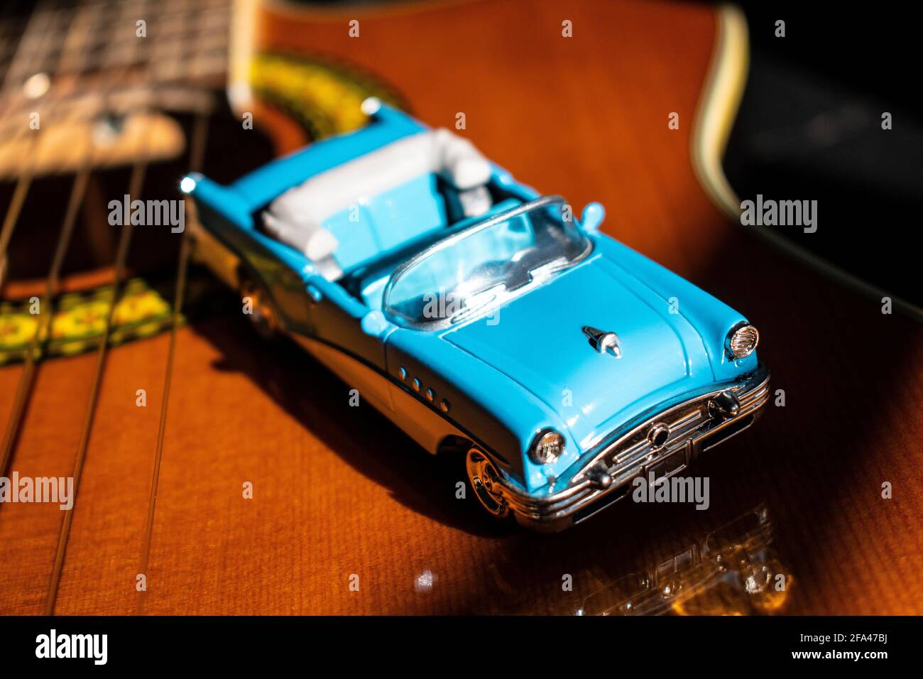 Classic or Creole guitar and collectible convertible car (diecast Stock ...