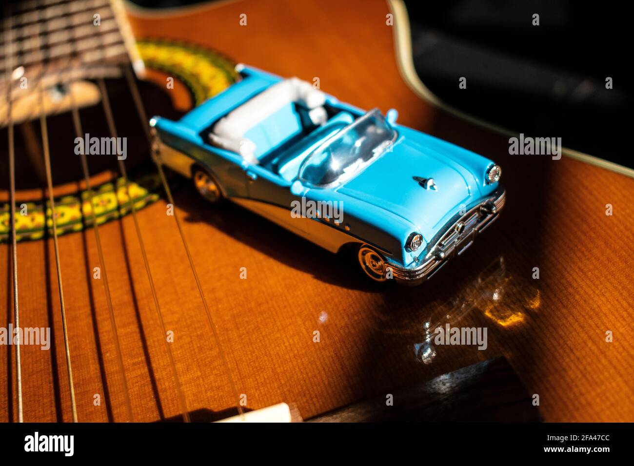 Classic or Creole guitar and collectible convertible car (diecast Stock ...