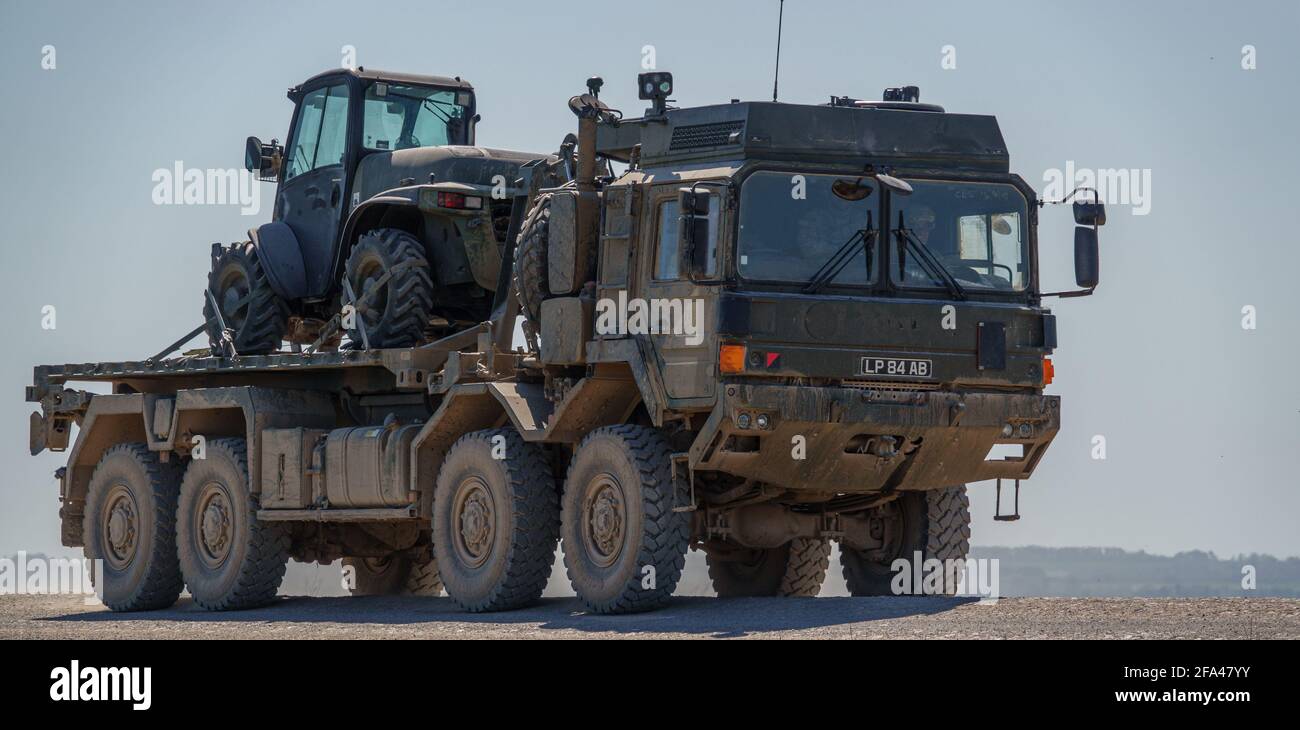 British Army 8 wheel MAN logistics truck carrying a 4 wheel fork lift ...