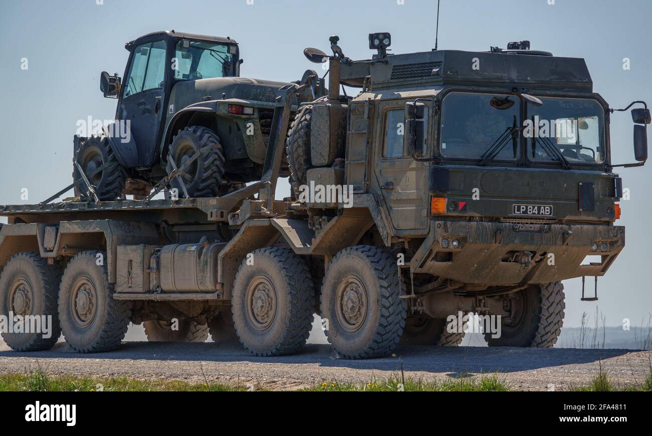 British Army 8 wheel MAN logistics truck carrying a 4 wheel fork lift ...