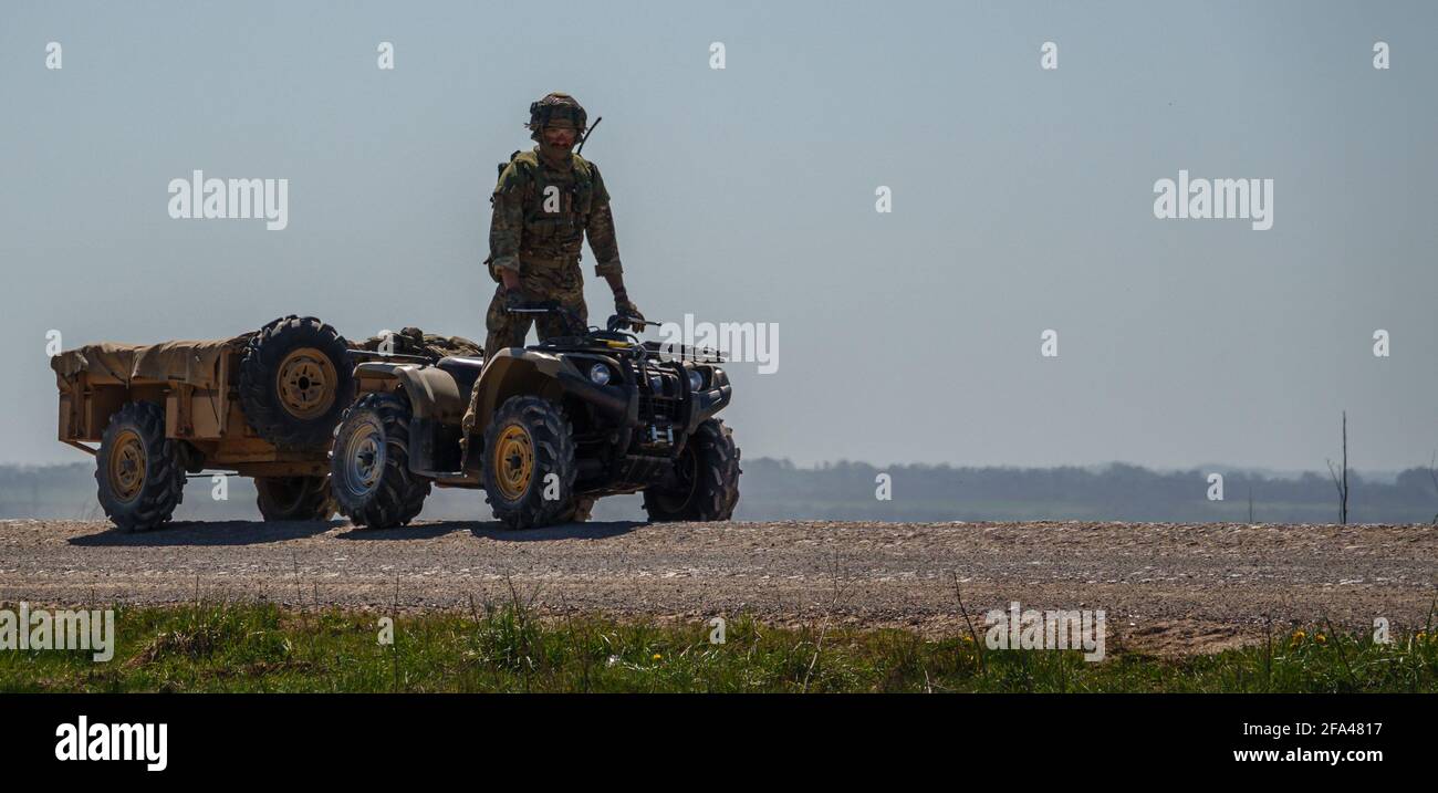 british army all-terrain quad driven by a light infantry soldier along ...