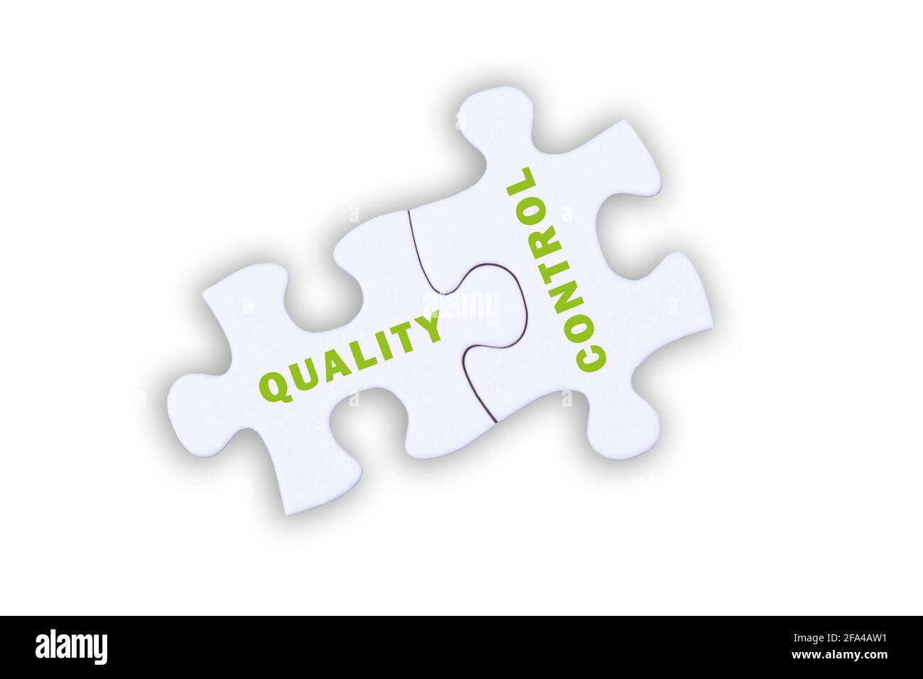 Top view of puzzle pieces with "Quality" and "Control" words isolated ...