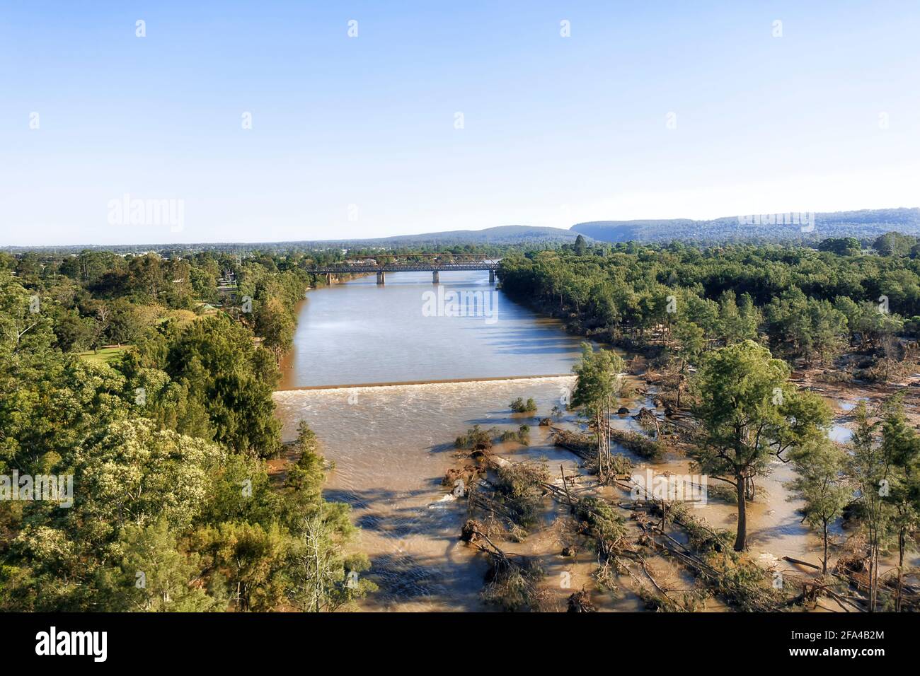 Weir on Nepean river with impact after floods - fallen trees in view of ...