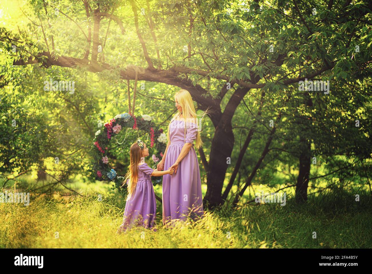 fashion outdoor photo of beautiful family look. beautiful mother Stock ...