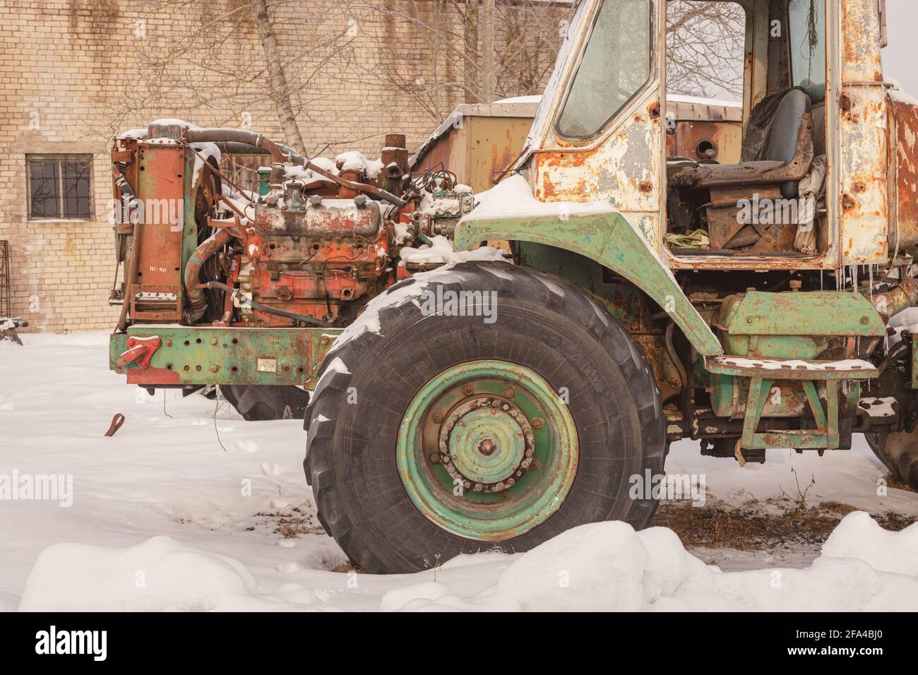old rusty abandoned tractors in snowy winter Stock Photo - Alamy