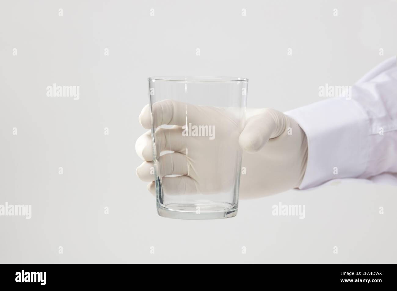 Hand holding transparent plastic glass hi-res stock photography and ...