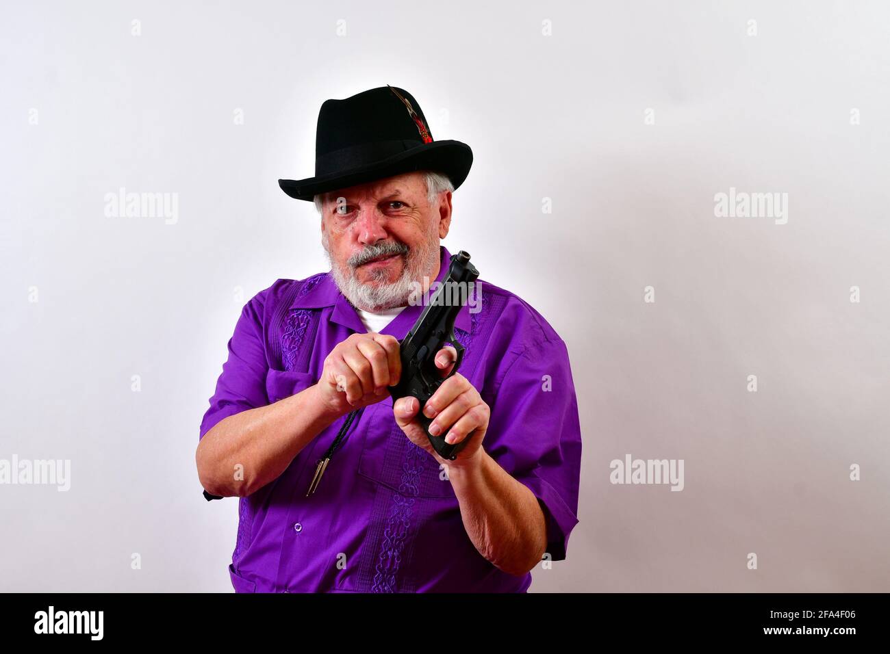 Angry-looking man with a 9mm automatic pistol is making an offer that ...