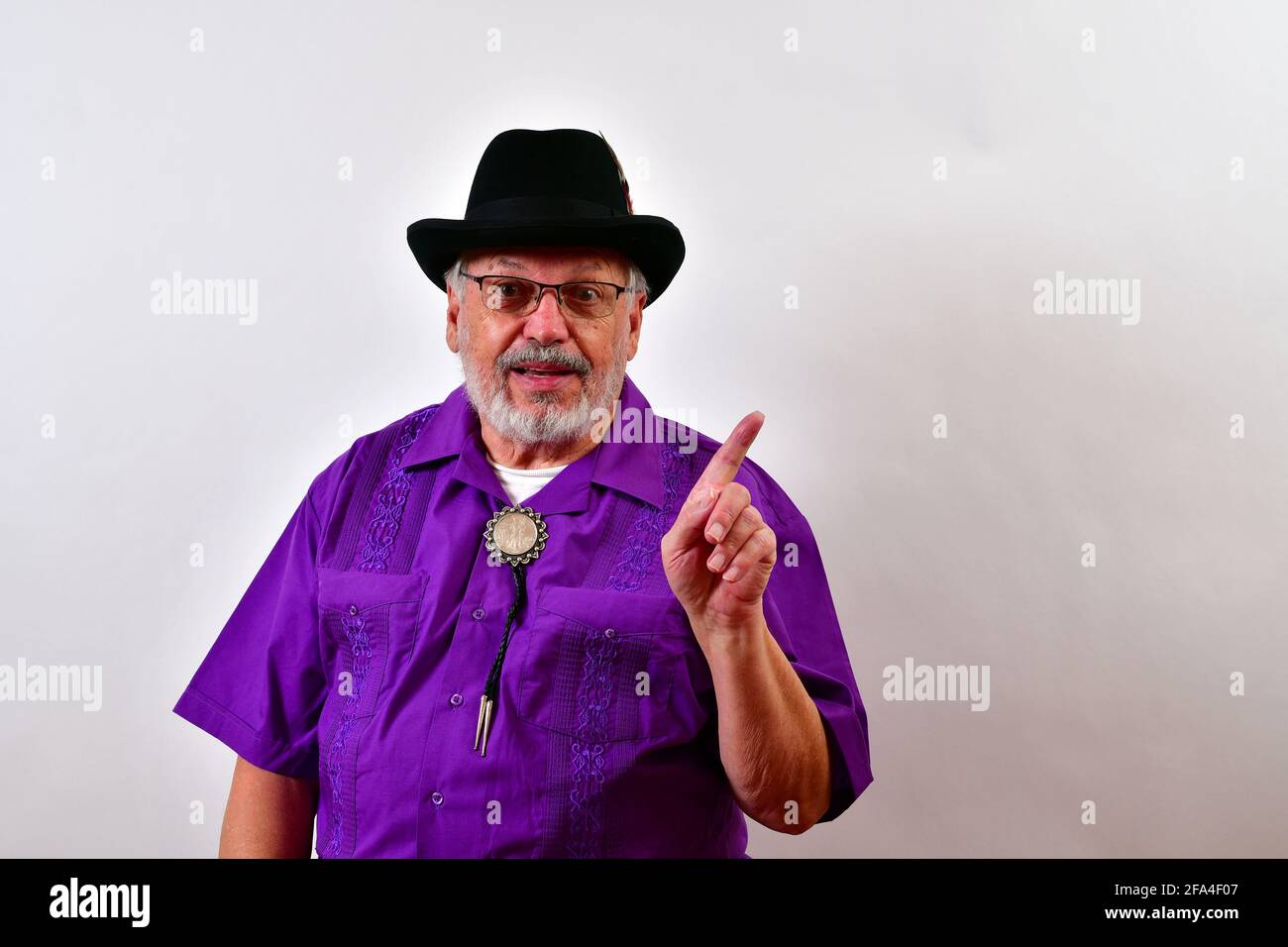 Elderly gentleman is pointing his finger at something off-camera Stock ...