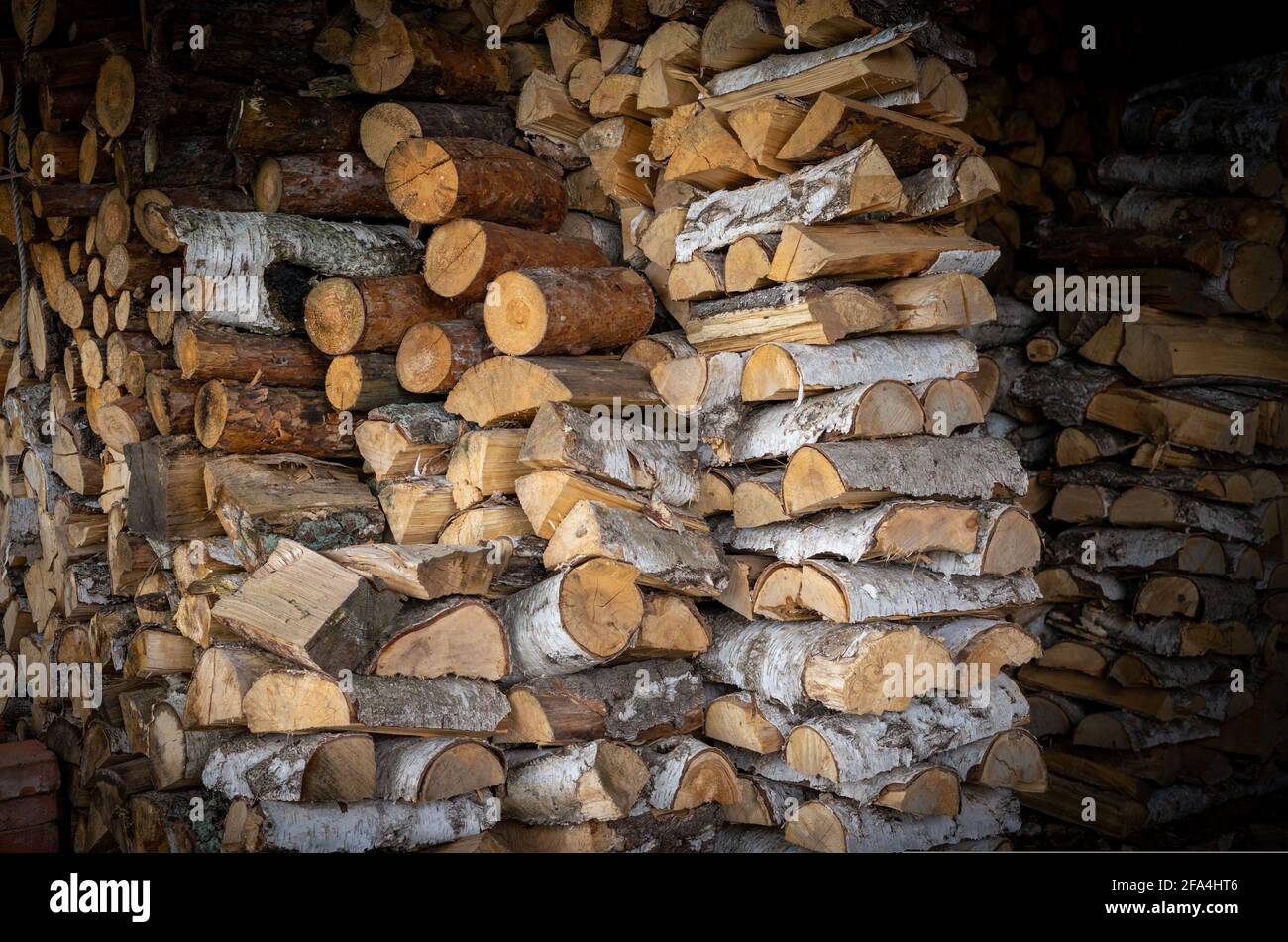 Stack of firewood piled together for winter Stock Photo - Alamy