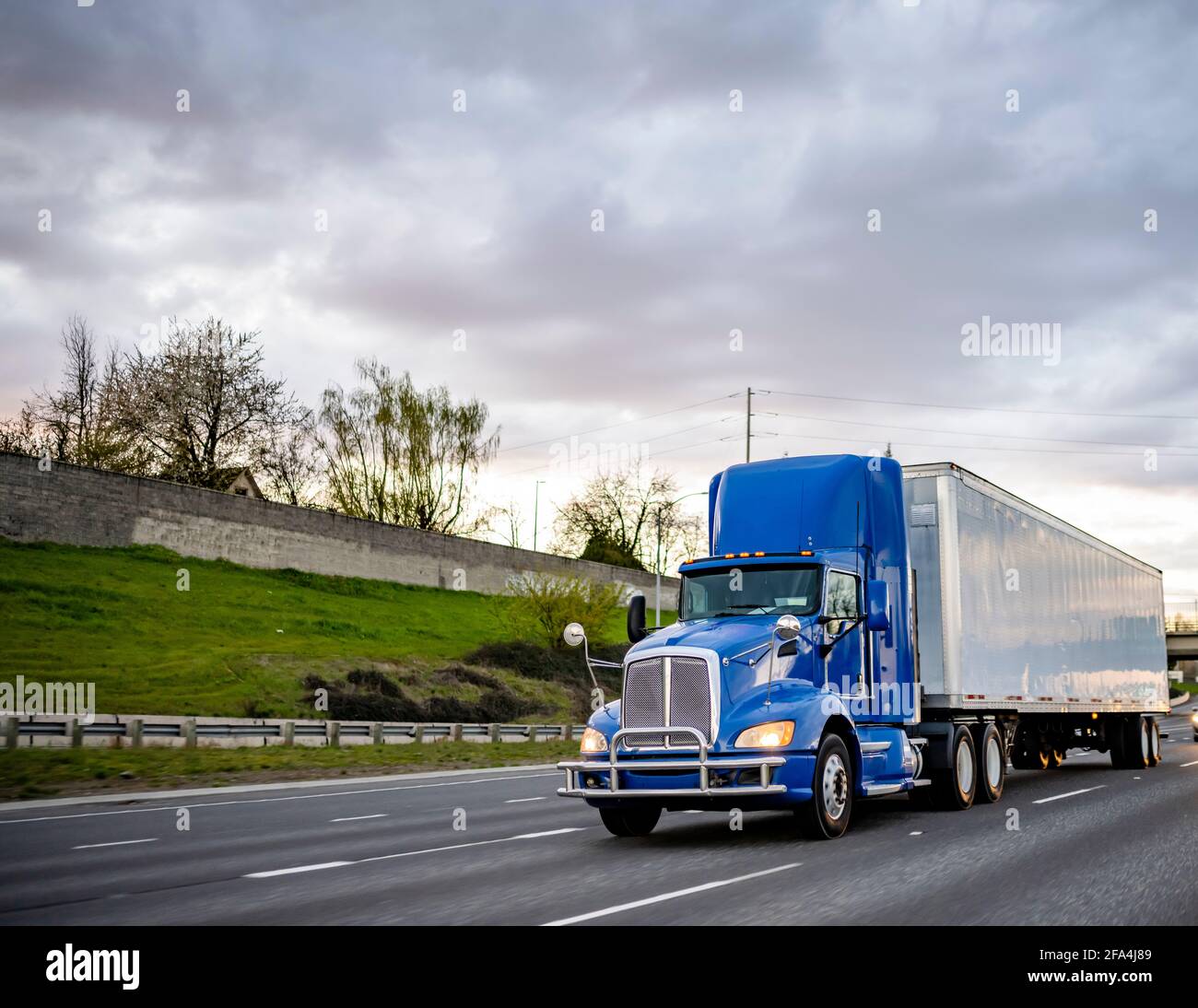 Day cab blue big rig industrial semi trucks tractor with roof spoiler ...
