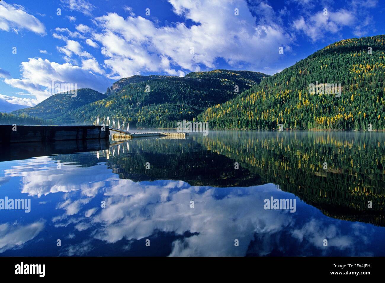 Bull Lake and dock in the Cabinet Mountains in fall. Bull River Valley ...