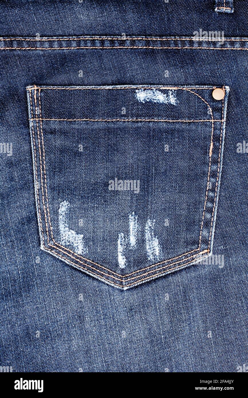 Blue worn jeans pocket close up, ripped jeans pocket background, dark ...