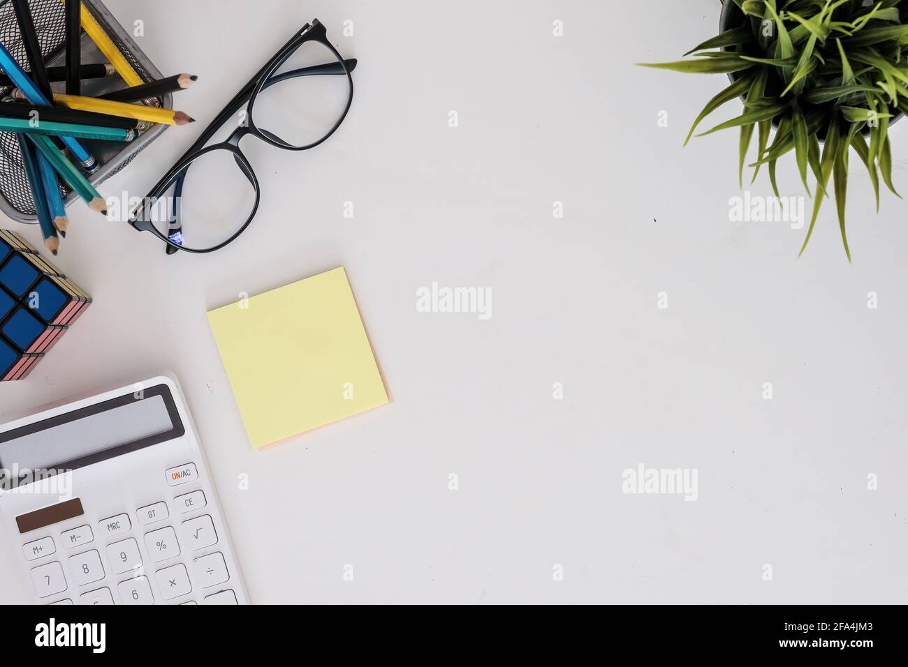 Modern white wooden desk table calculator and business tools office ...