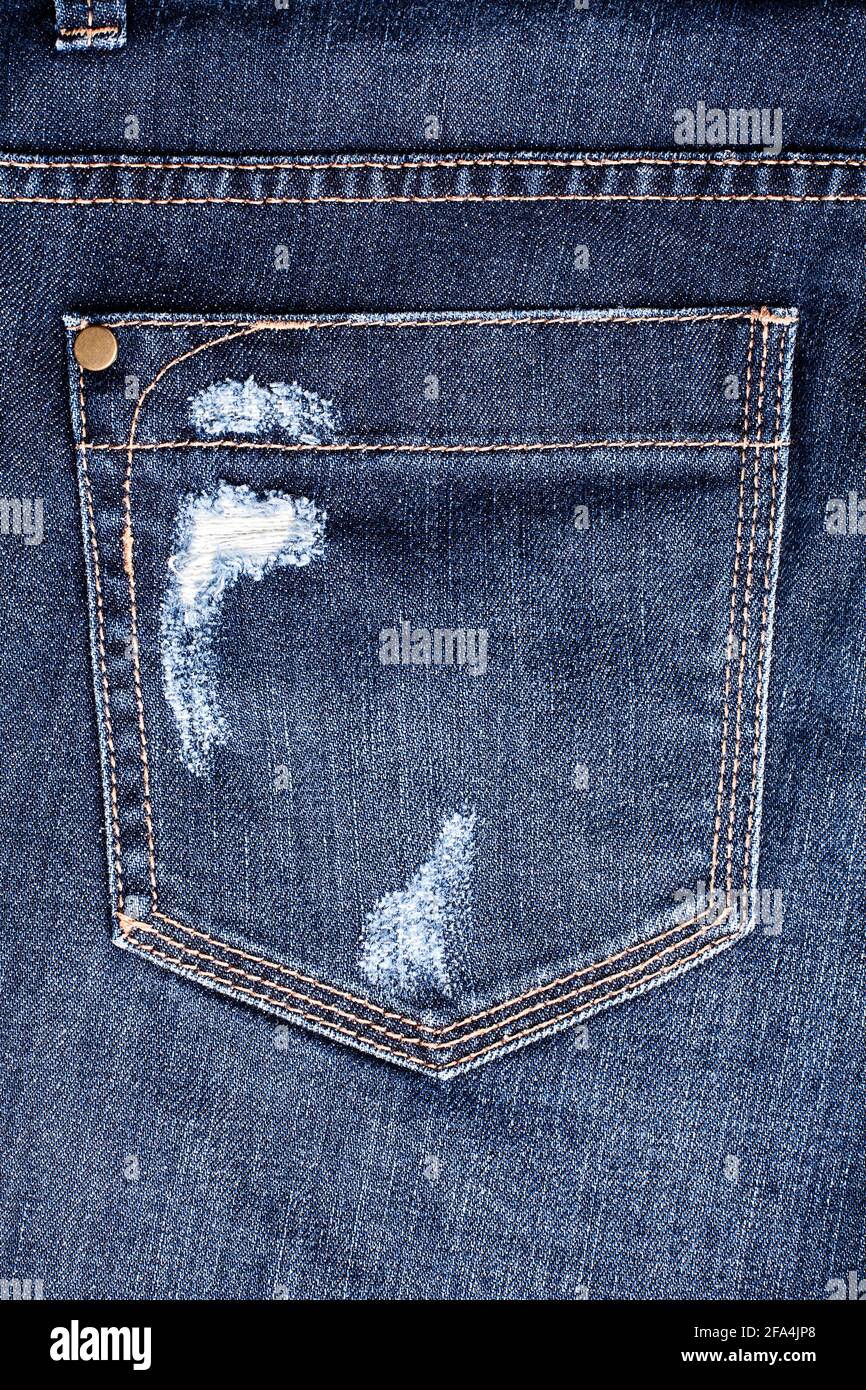 Blue worn jeans pocket close up, ripped jeans pocket background, dark ...