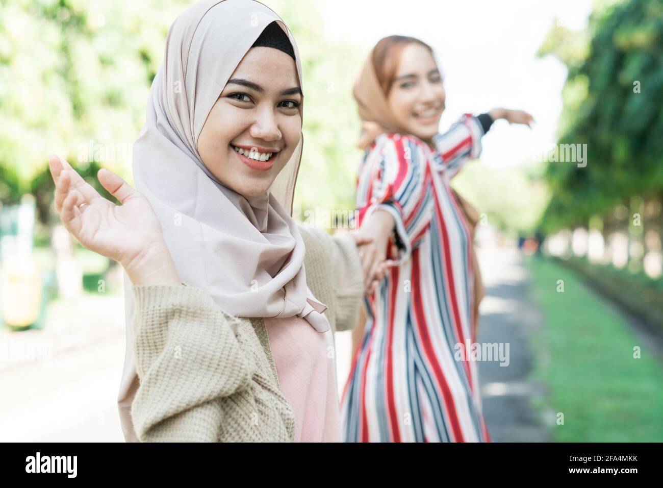 Two friends enjoying the summer sun Stock Photo - Alamy
