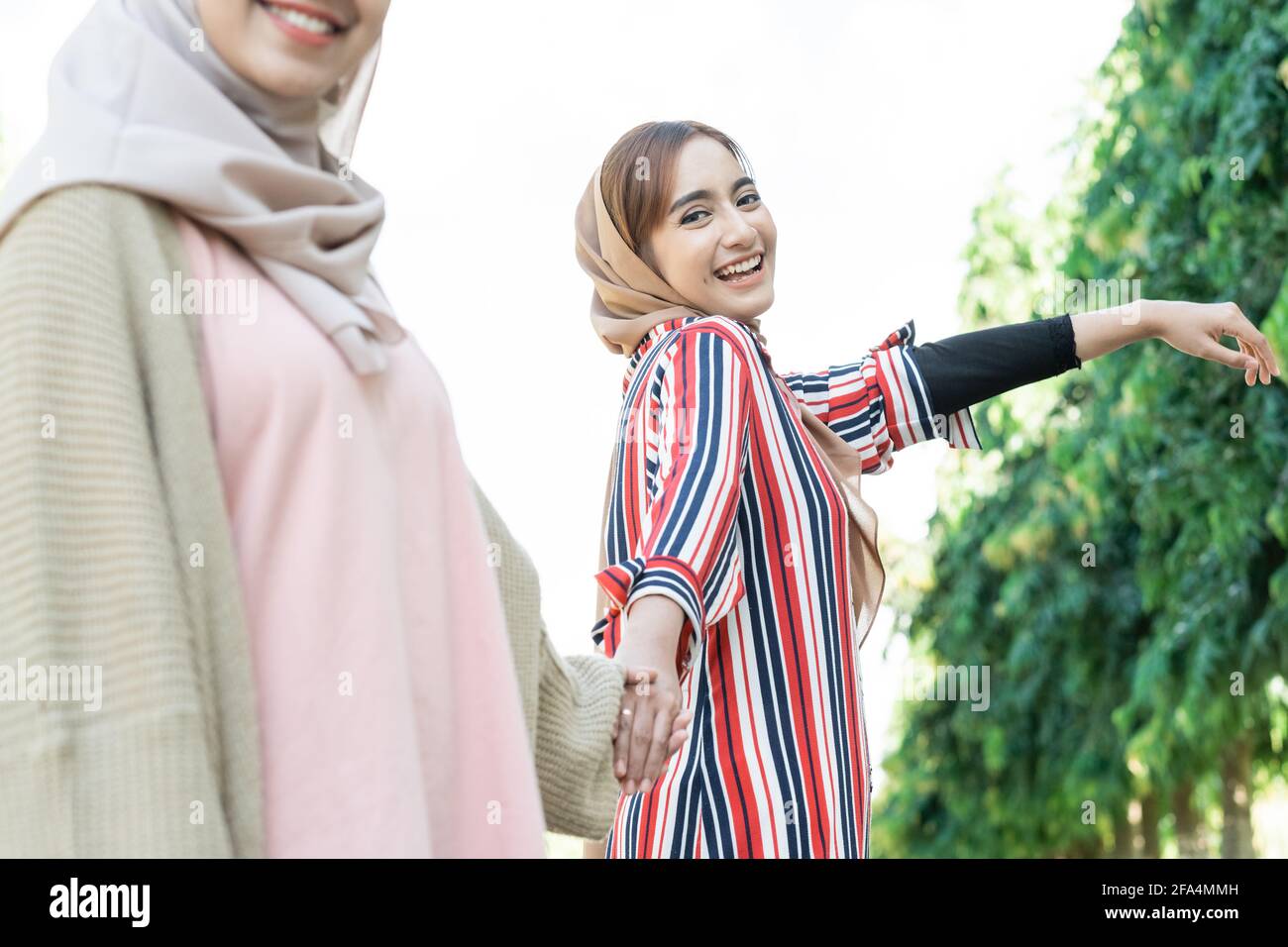 Two friends enjoying the summer sun Stock Photo - Alamy