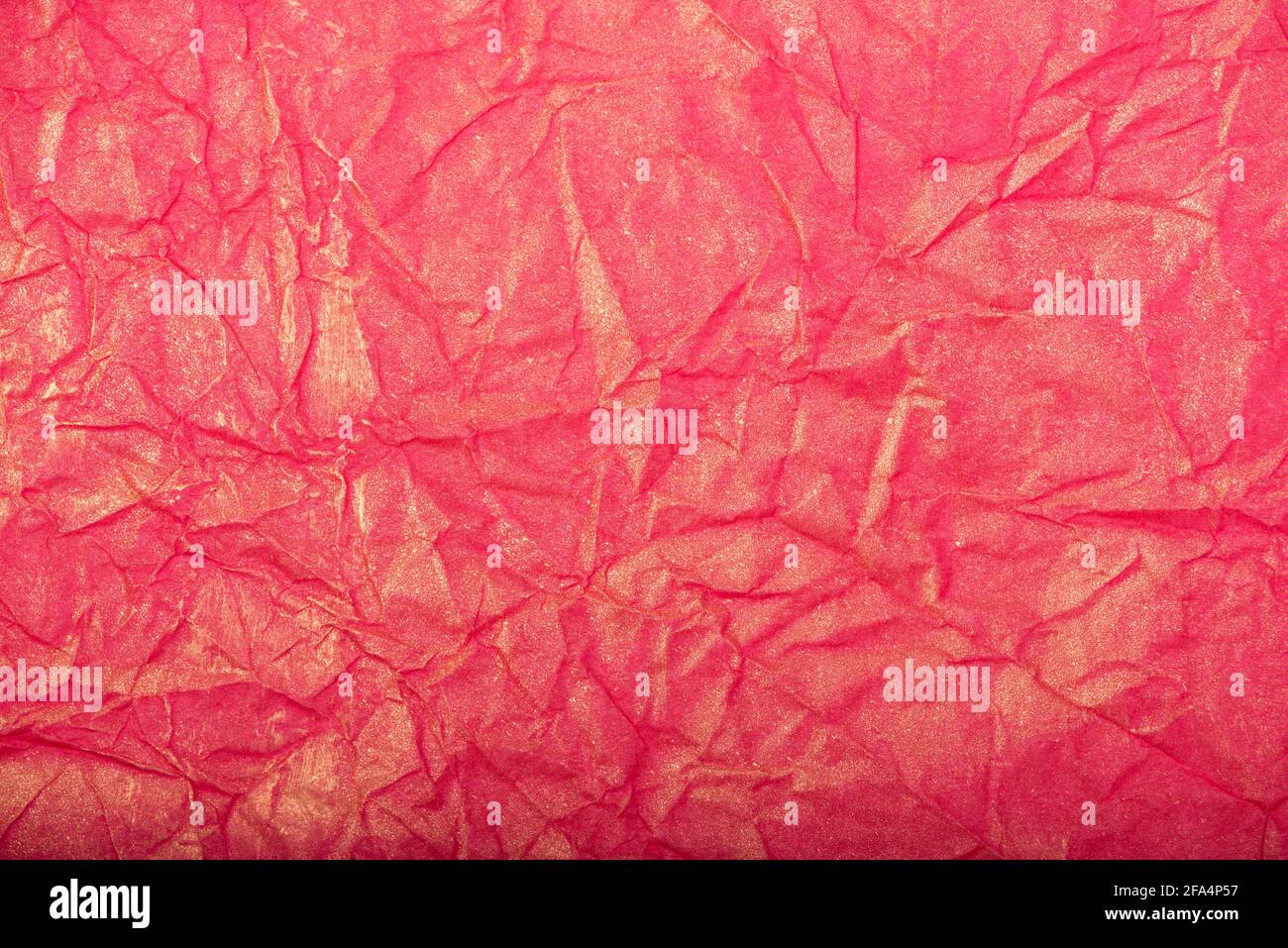 Pink crumpled paper texture or background Stock Photo - Alamy