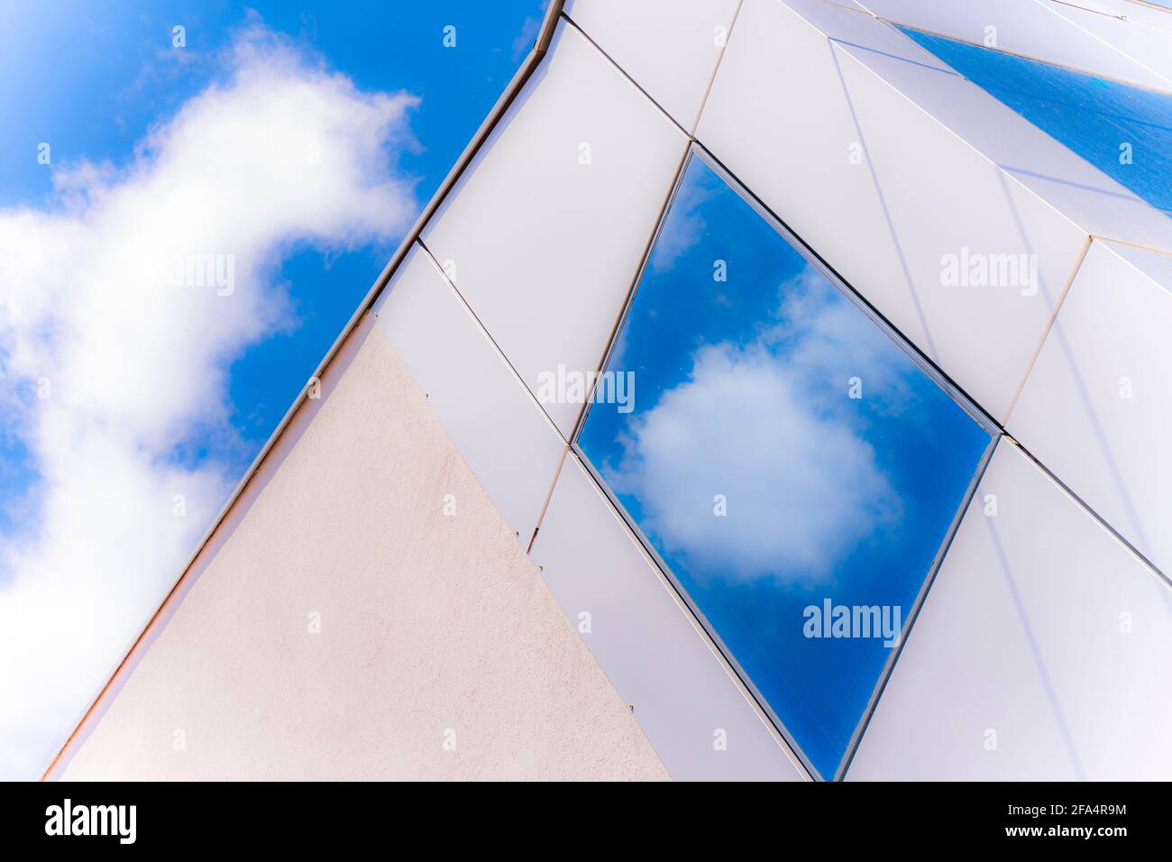 Blue sky reflection oin the window of modern building Stock Photo - Alamy