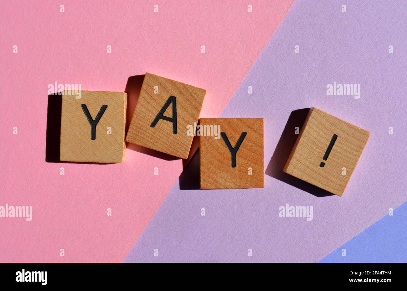 Yay, word in wooden alphabet letters isolated on colourful background ...