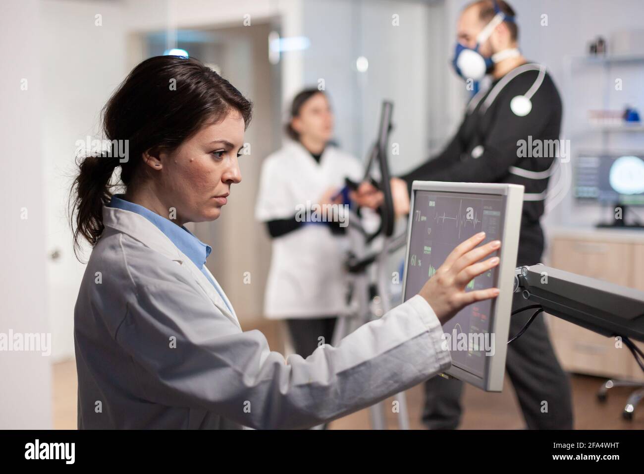 Professional male runner testing his muscle endurance in science sport ...