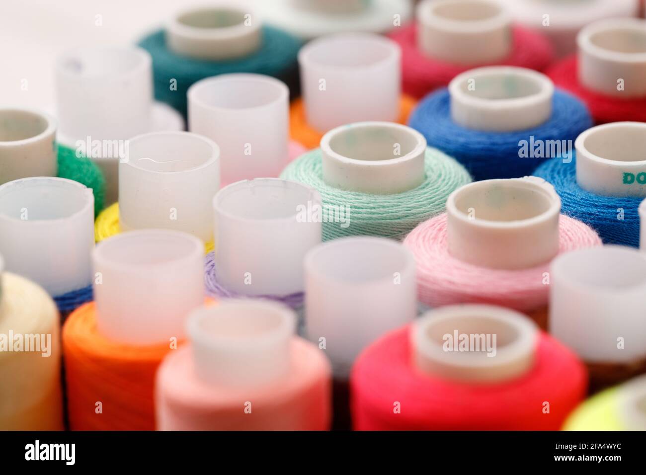 Close up of colored thread coils, thread spools background Stock Photo ...