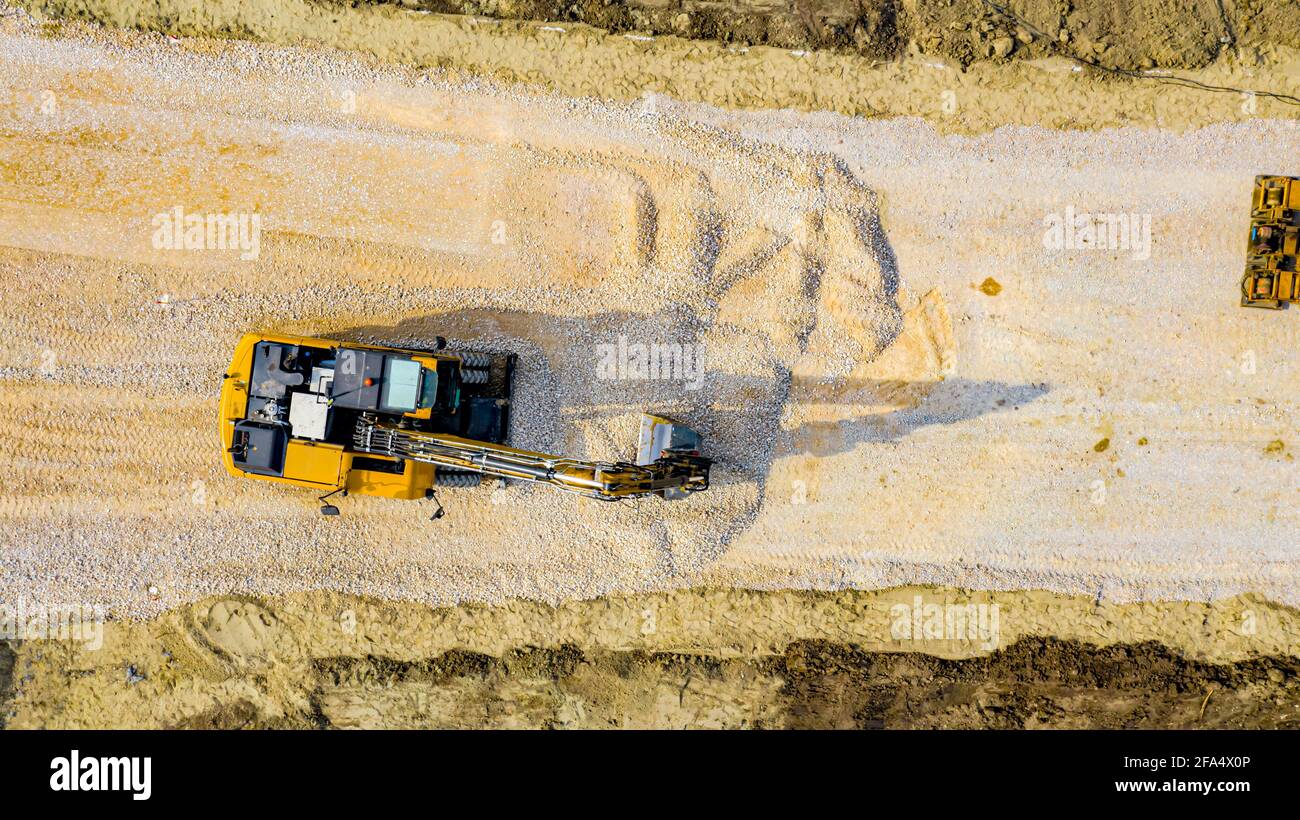Above top view, overhead on excavator until is leveling layer of ...