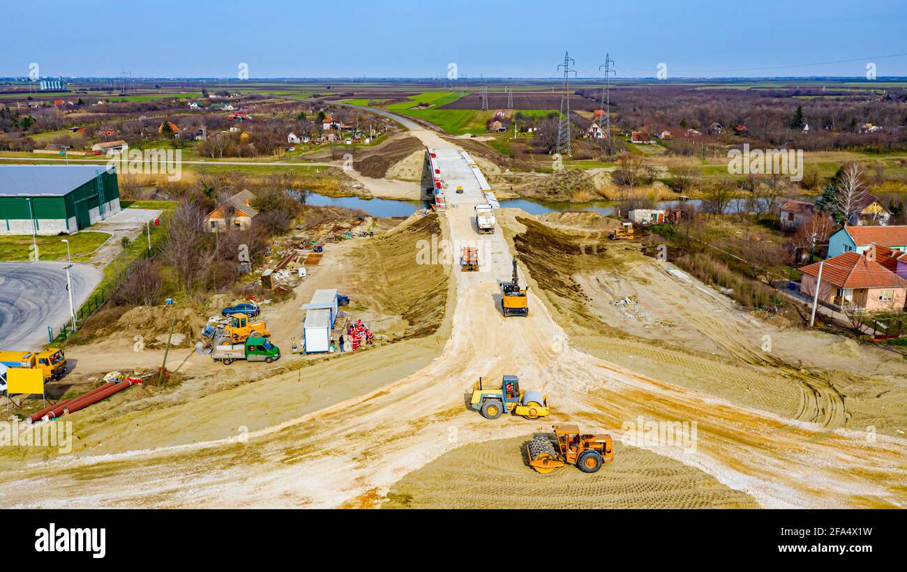 Above view, on circular road, roundabout under construction, crew of ...